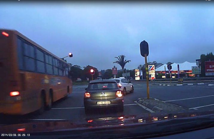 Dashboard camera captures bus accelerating through red light in ...